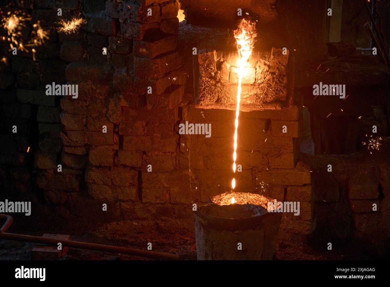 Hot Liquid Molten Iron Pouring from Industrial Furnace Stock Photo - Alamy