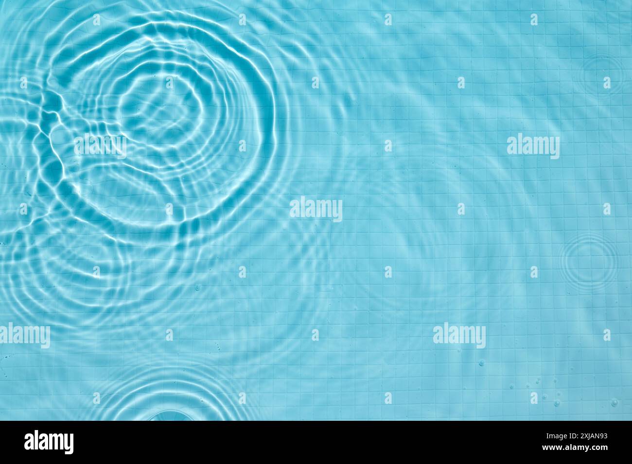 Ripples in Blue Pool. Calming ripples in a clear blue swimming pool ...