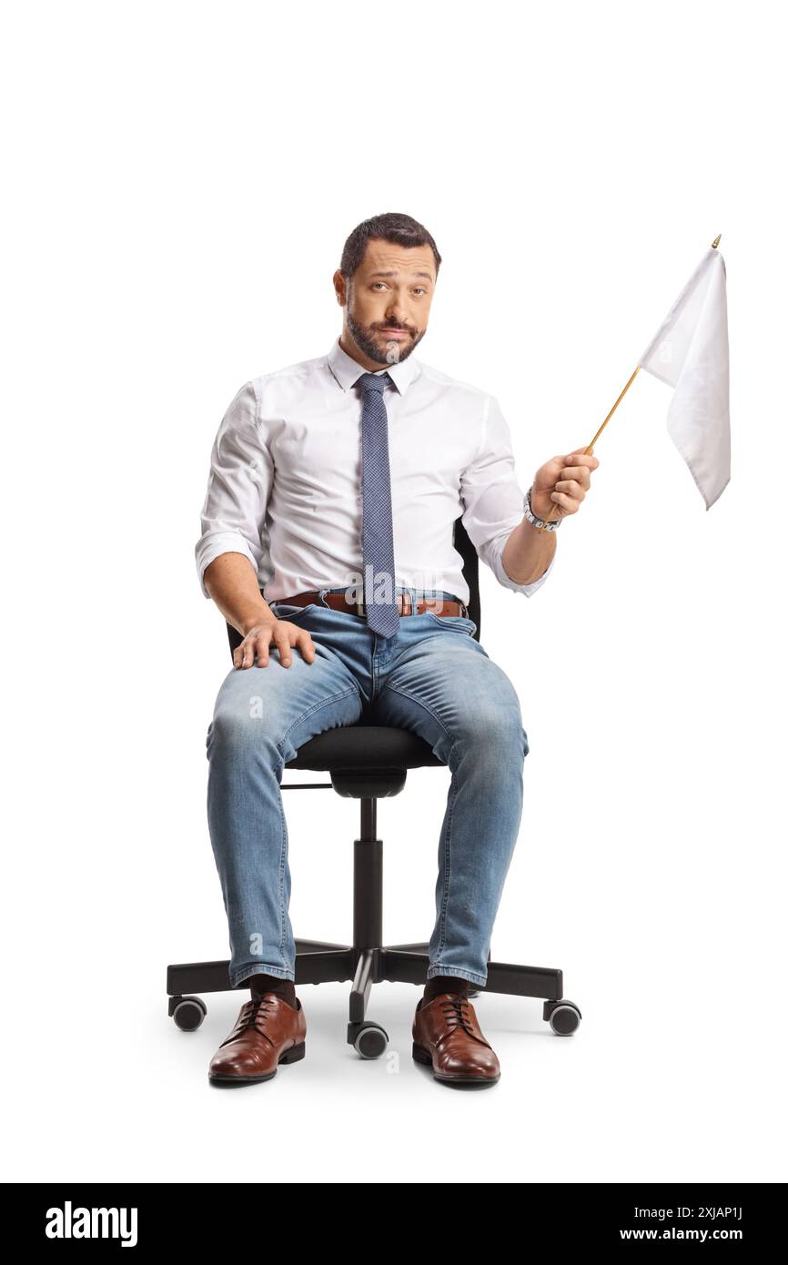 Sad businessman sitting in an office chair and holding a white flag ...