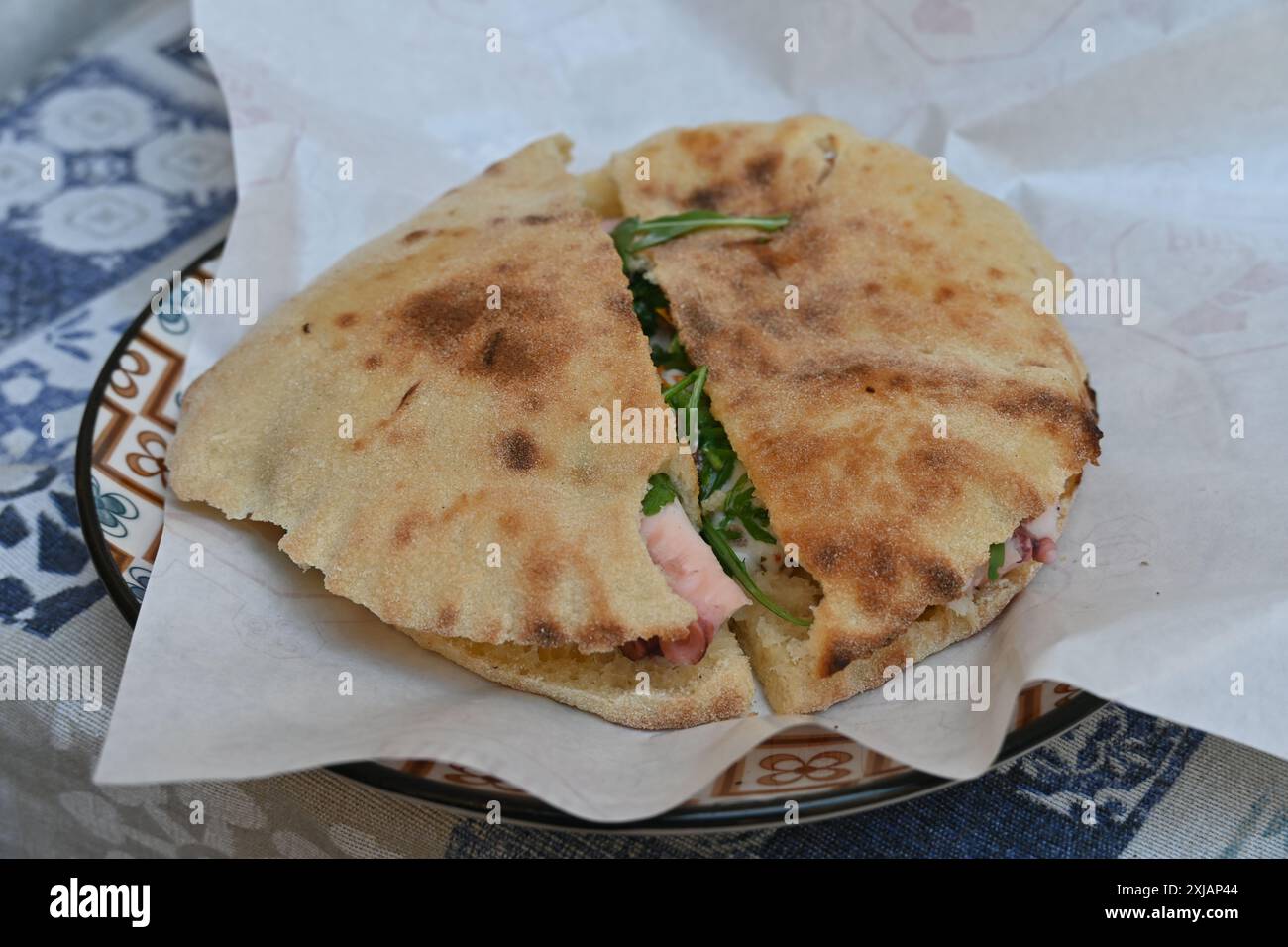 View of a "puccia" a traditional bread from Puglia, made with pizza ...