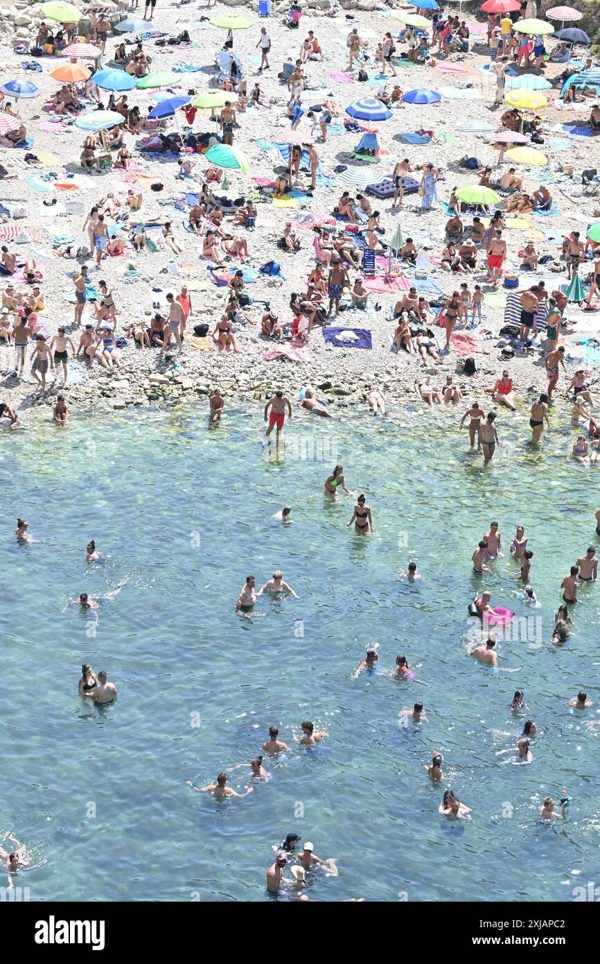 People on the beach in Polignano a Mare, a small coastal town in Apulia ...