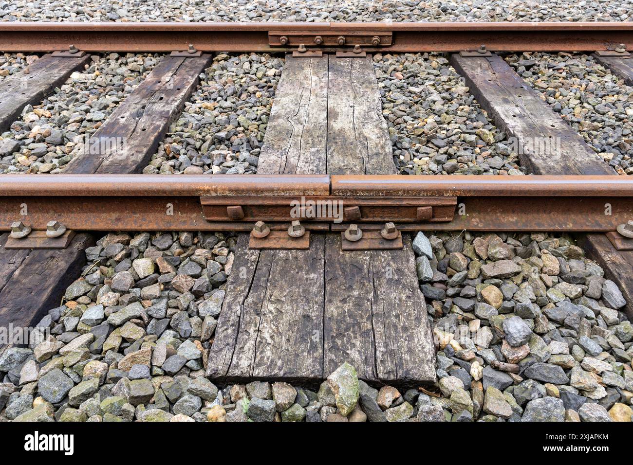 bonded 4-bolt rail joint on tracks with wooden sleepers Stock Photo - Alamy