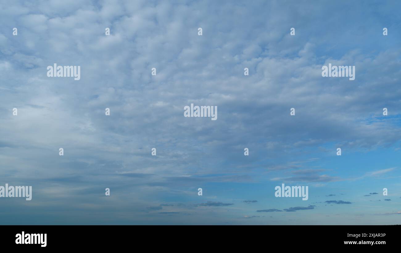 Timelapse. Fluffy layered clouds sky atmosphere. Puffy fluffy white ...