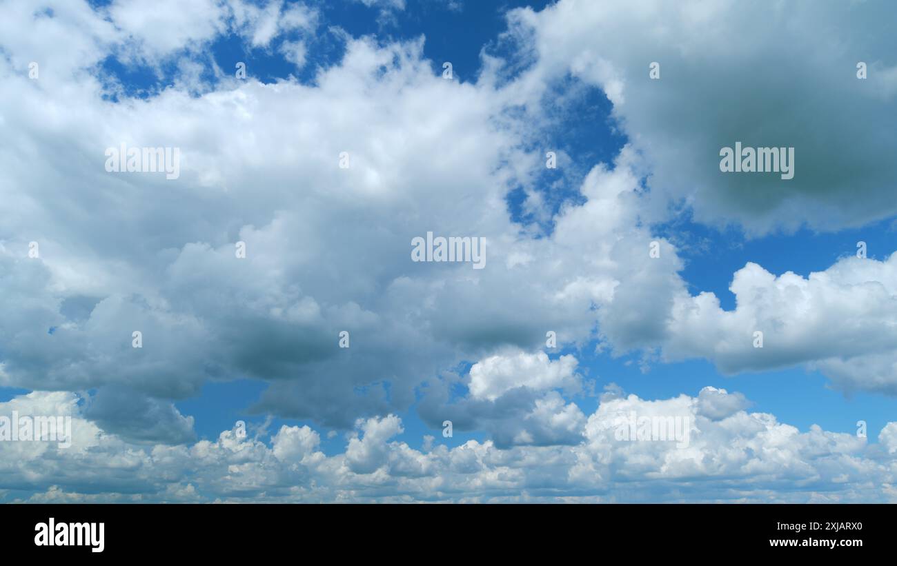 Time lapse. Blue heaven summer cloudscape. Rolling puffy white clouds ...
