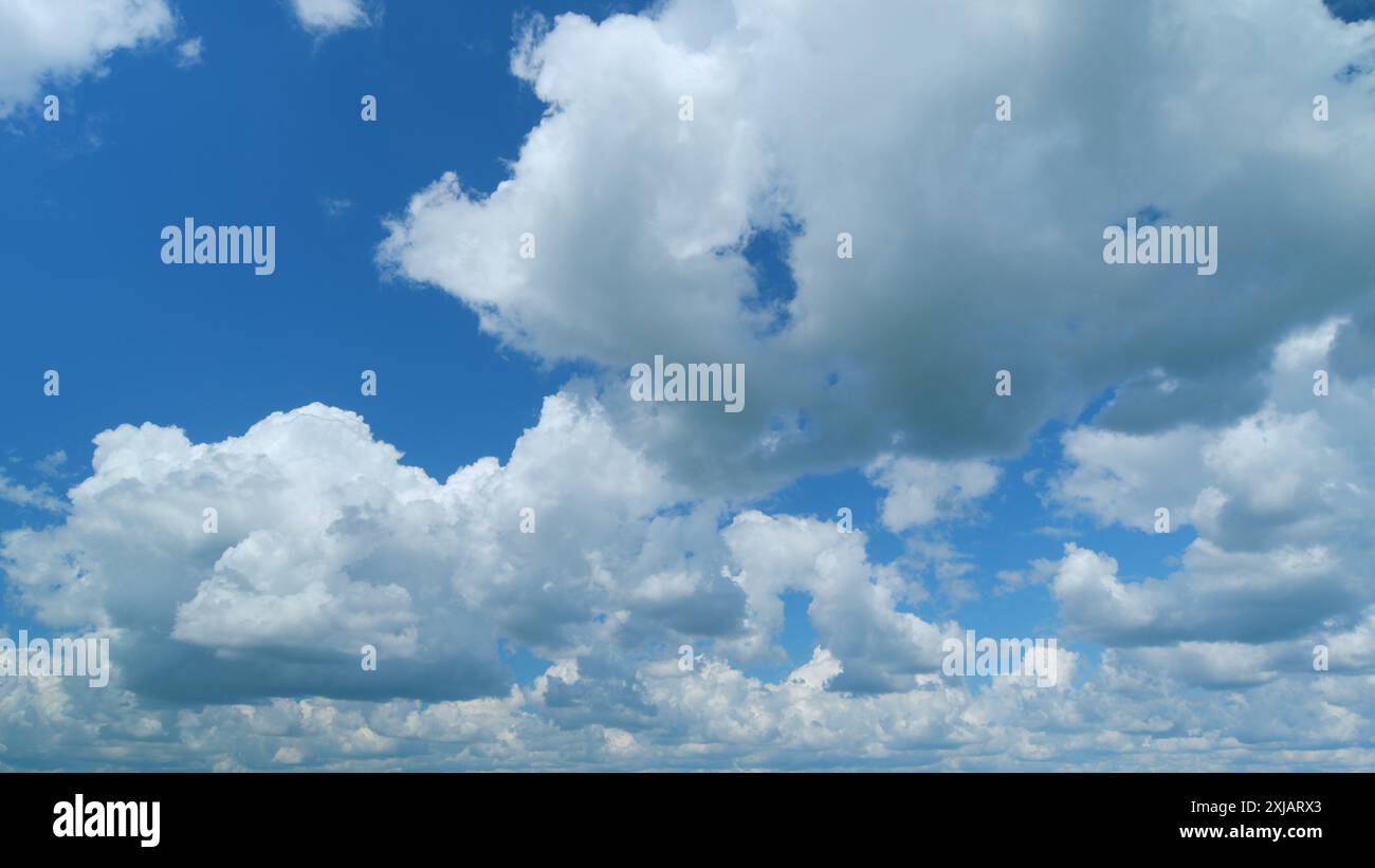 Time lapse. Fluffy curly rolling cloud in windy Summer weather. White ...