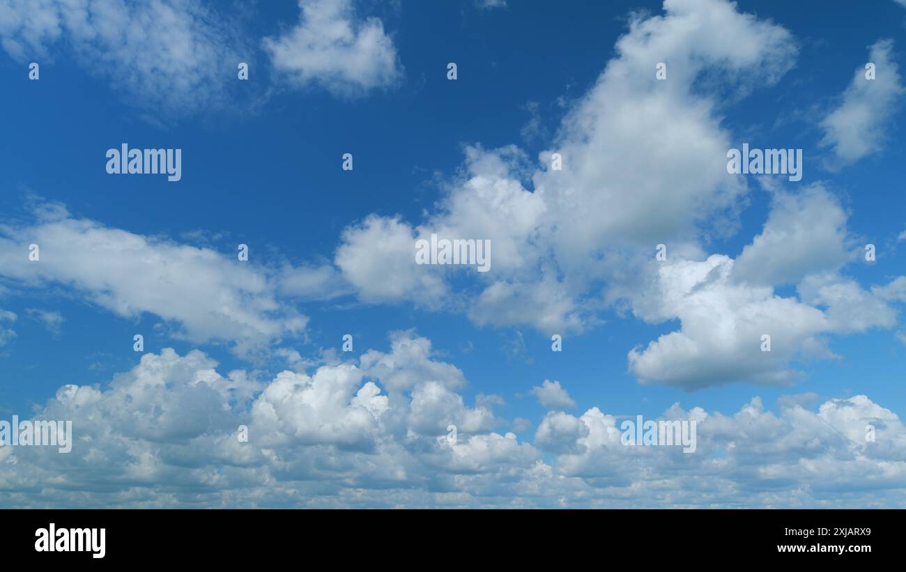 Time lapse. Blue sky white puffy fluffy clouds billow in high space. Sky with clouds weather ...