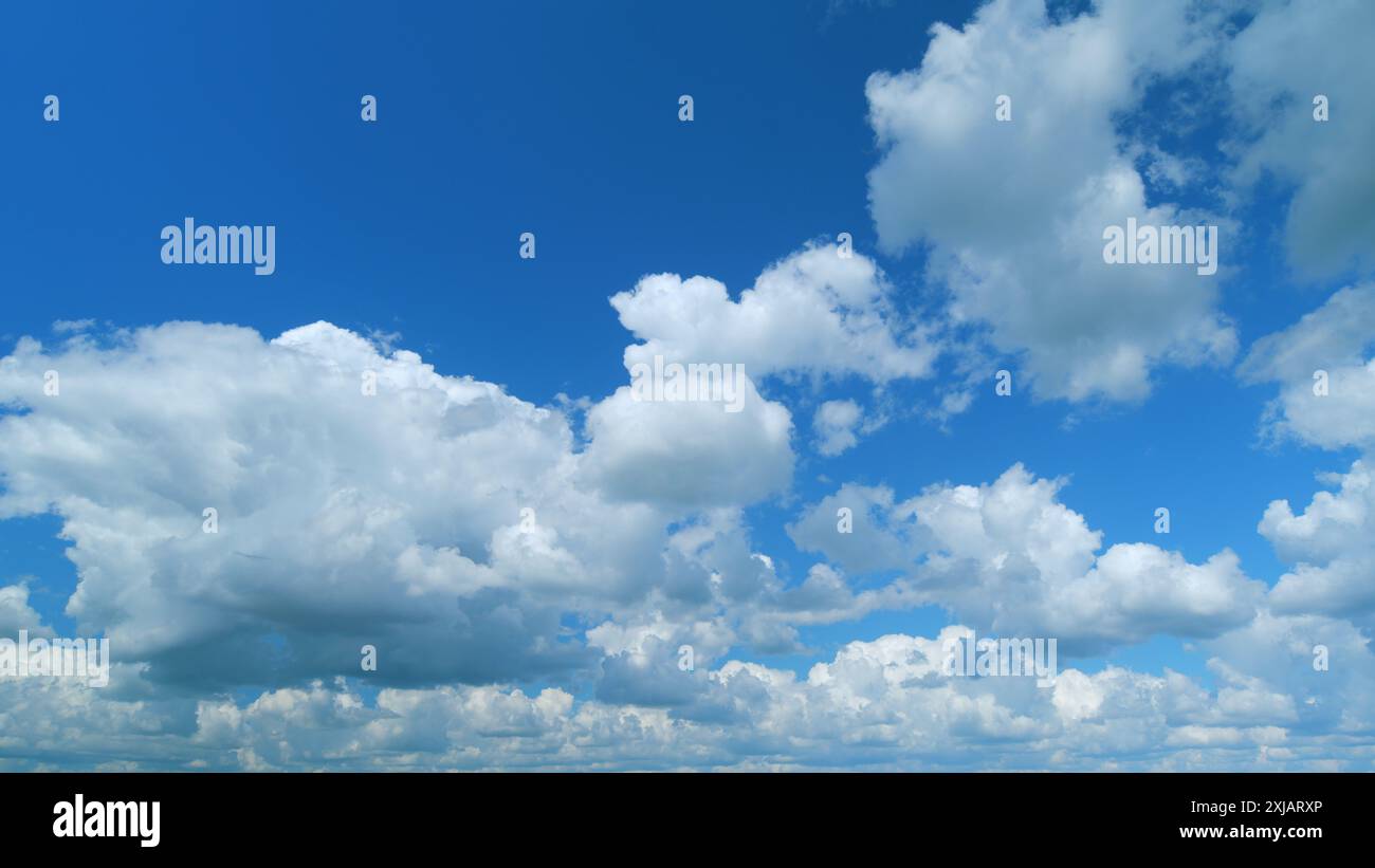 Time lapse. Blue sky with copyspace background with forming clouds in ...