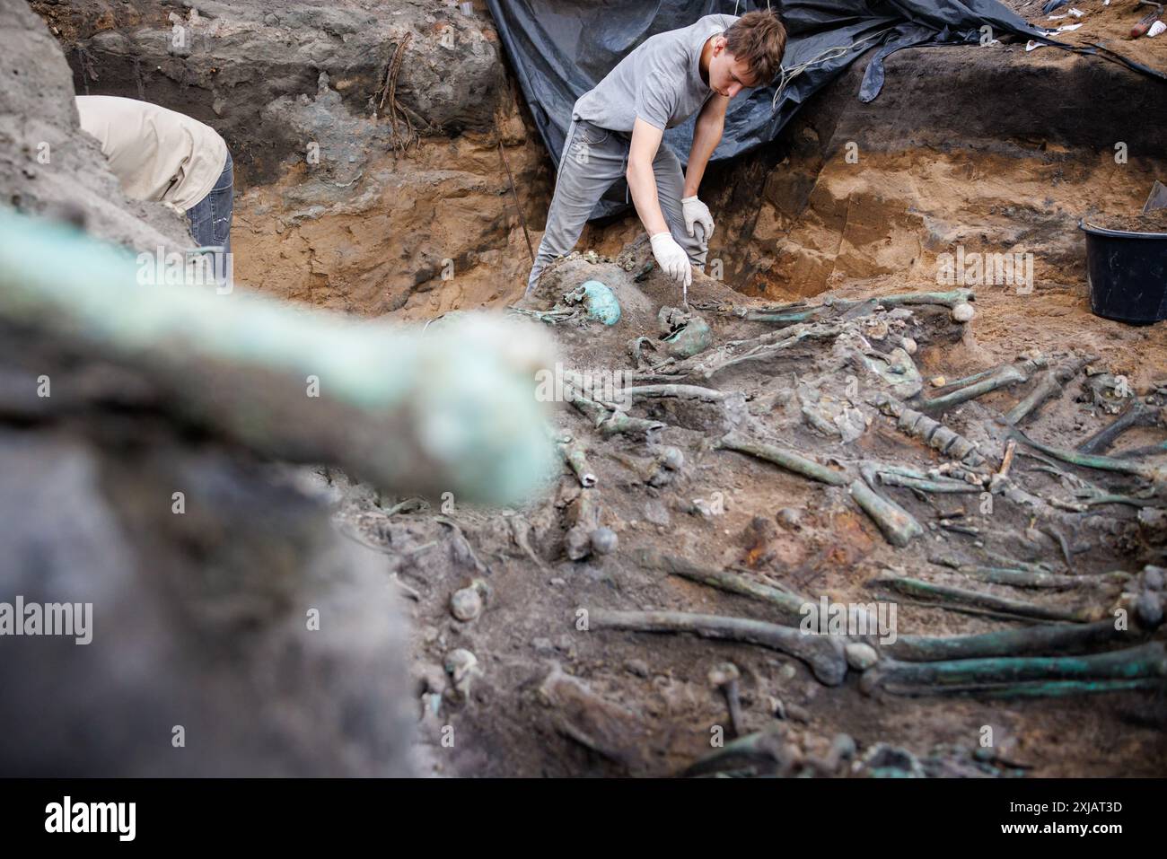 Nuremberg, Germany. 17th July, 2024. An archaeologist uncovers the ...