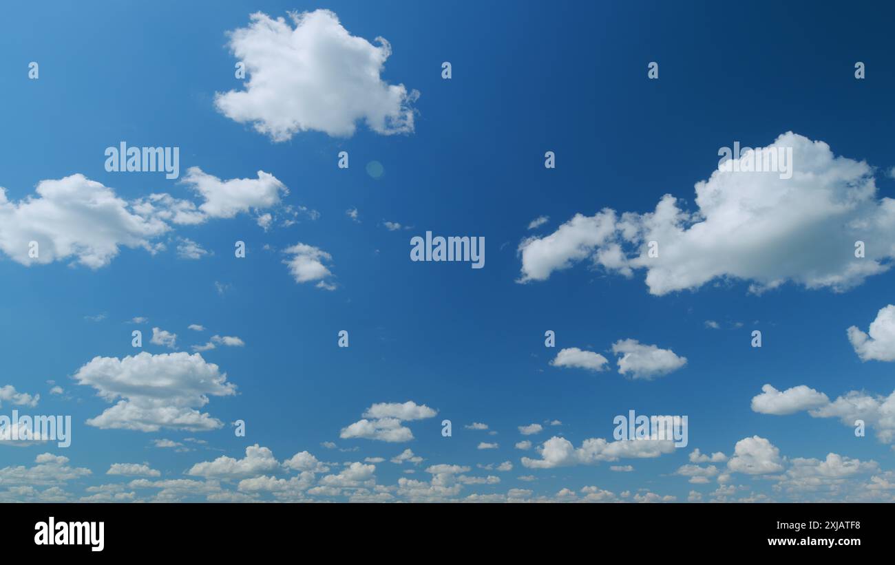 Time lapse. Puffy fluffy white clouds. Forming cloud moving with blue ...
