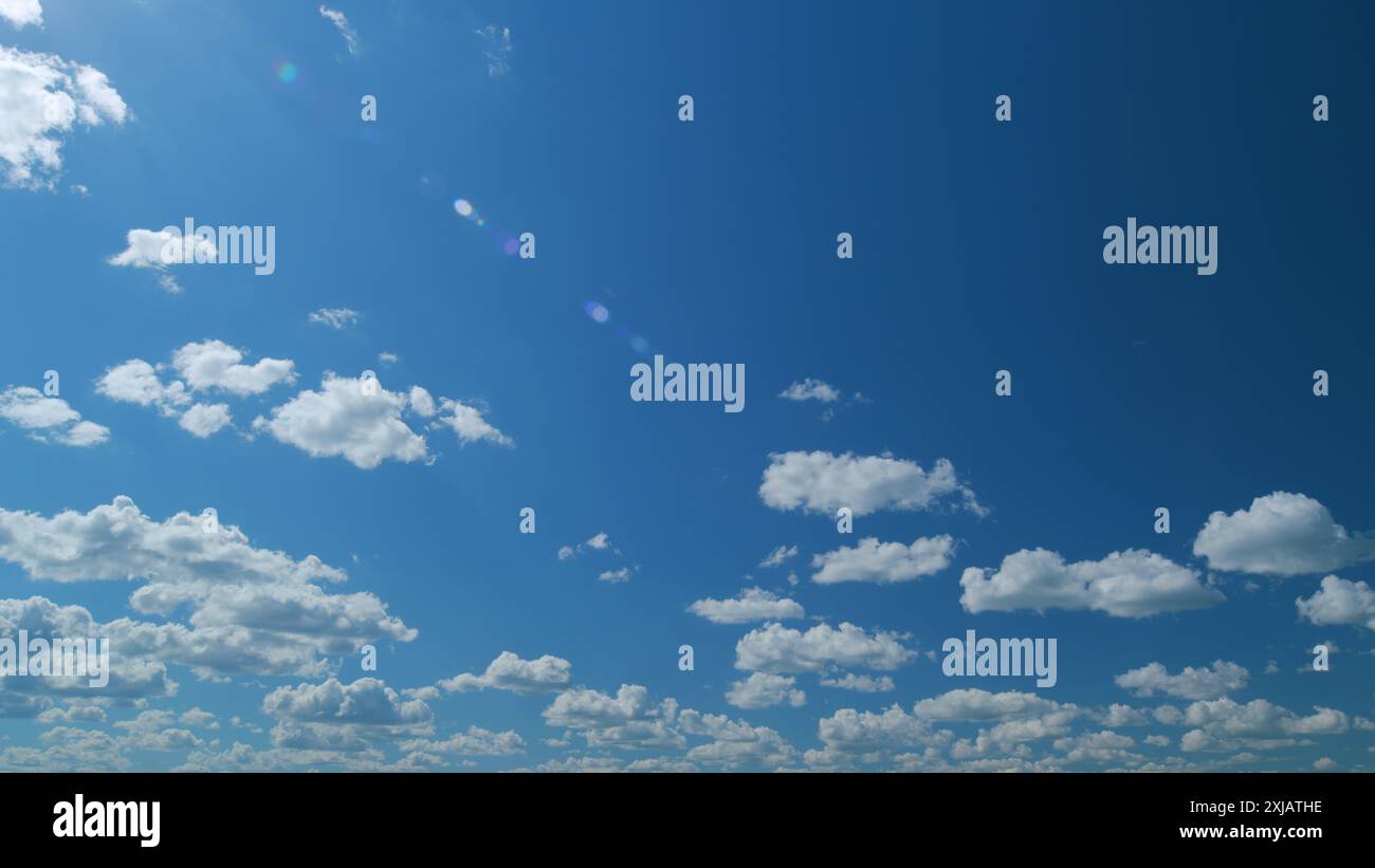 Time lapse. Blue sky white puffy fluffy clouds billow in high space. Sky with clouds weather ...