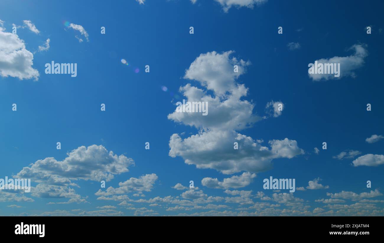 Time lapse. Blue heaven summer cloudscape. Rolling puffy white clouds ...