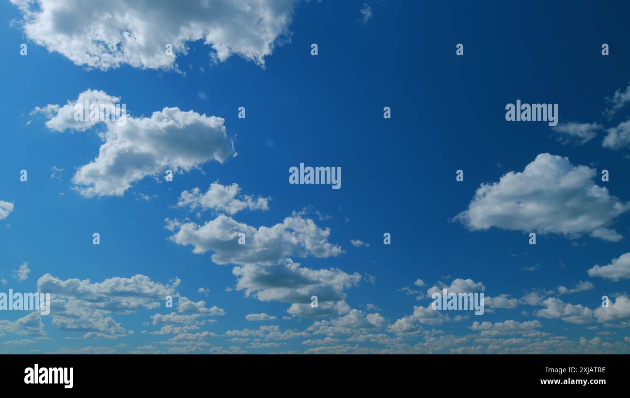 Time lapse. Blue sky with copyspace background with forming clouds in ...