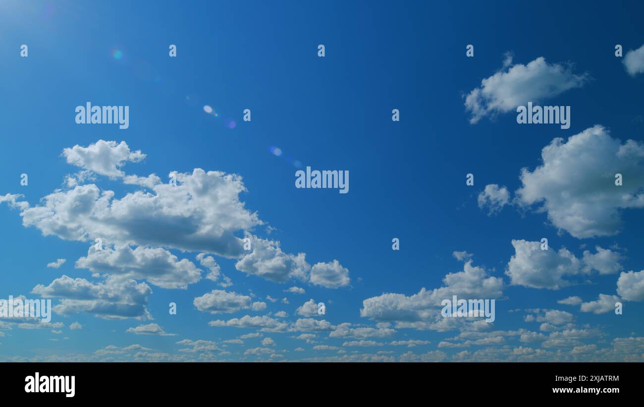 Time lapse. Blue sky white puffy fluffy clouds billow in high space. Sky with clouds weather ...