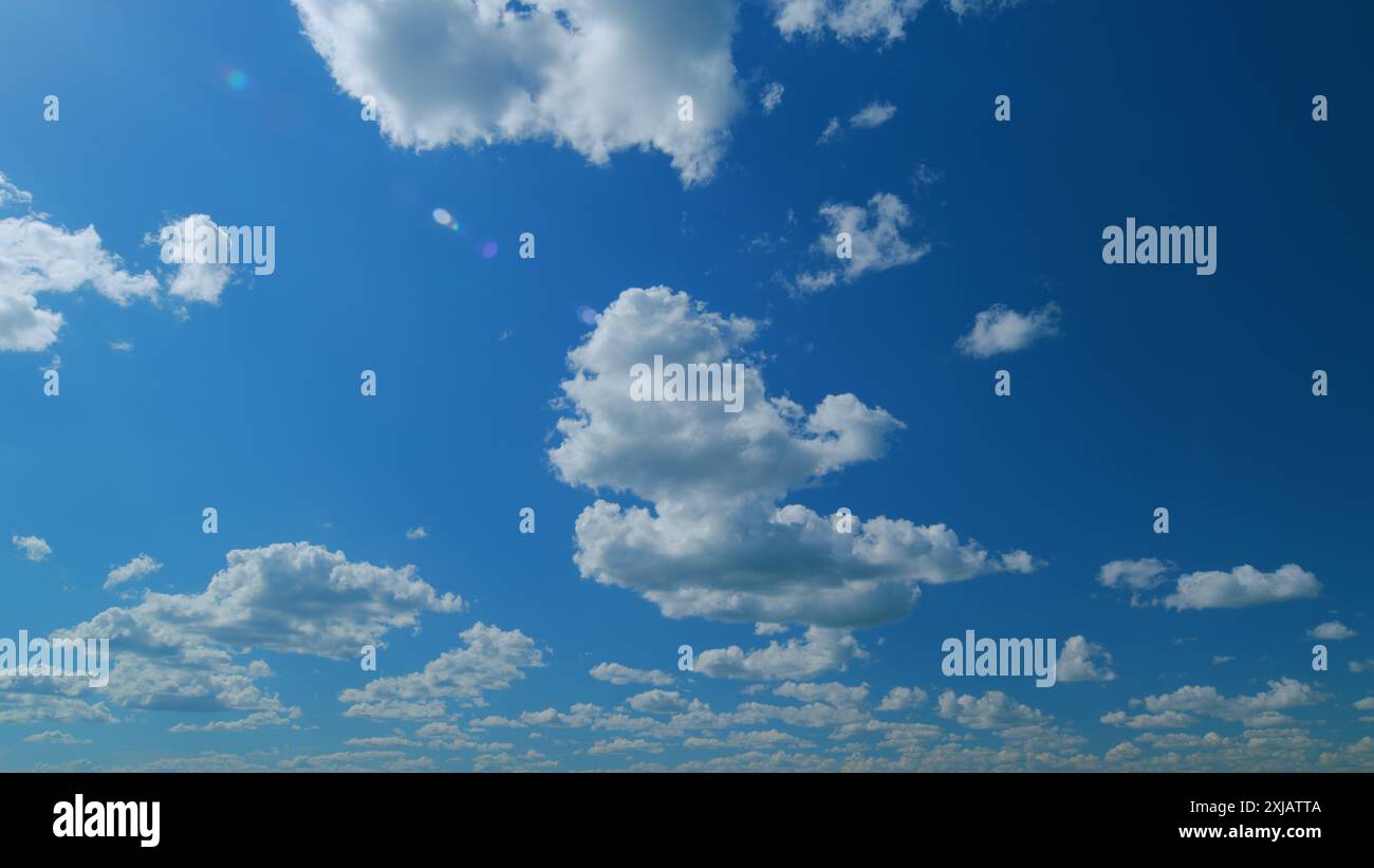 Time lapse. Fluffy curly rolling cloud in windy Summer weather. White ...