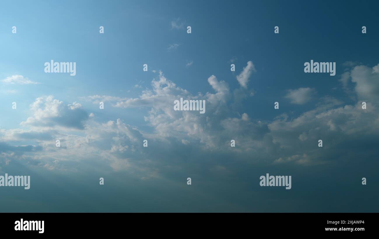 Time lapse. Fluffy layered clouds sky atmosphere. Puffy fluffy white ...