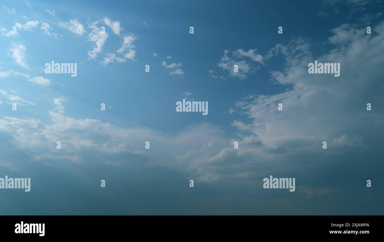 Time lapse. Summer fluffy rolling clouds, windy weather in daytime ...