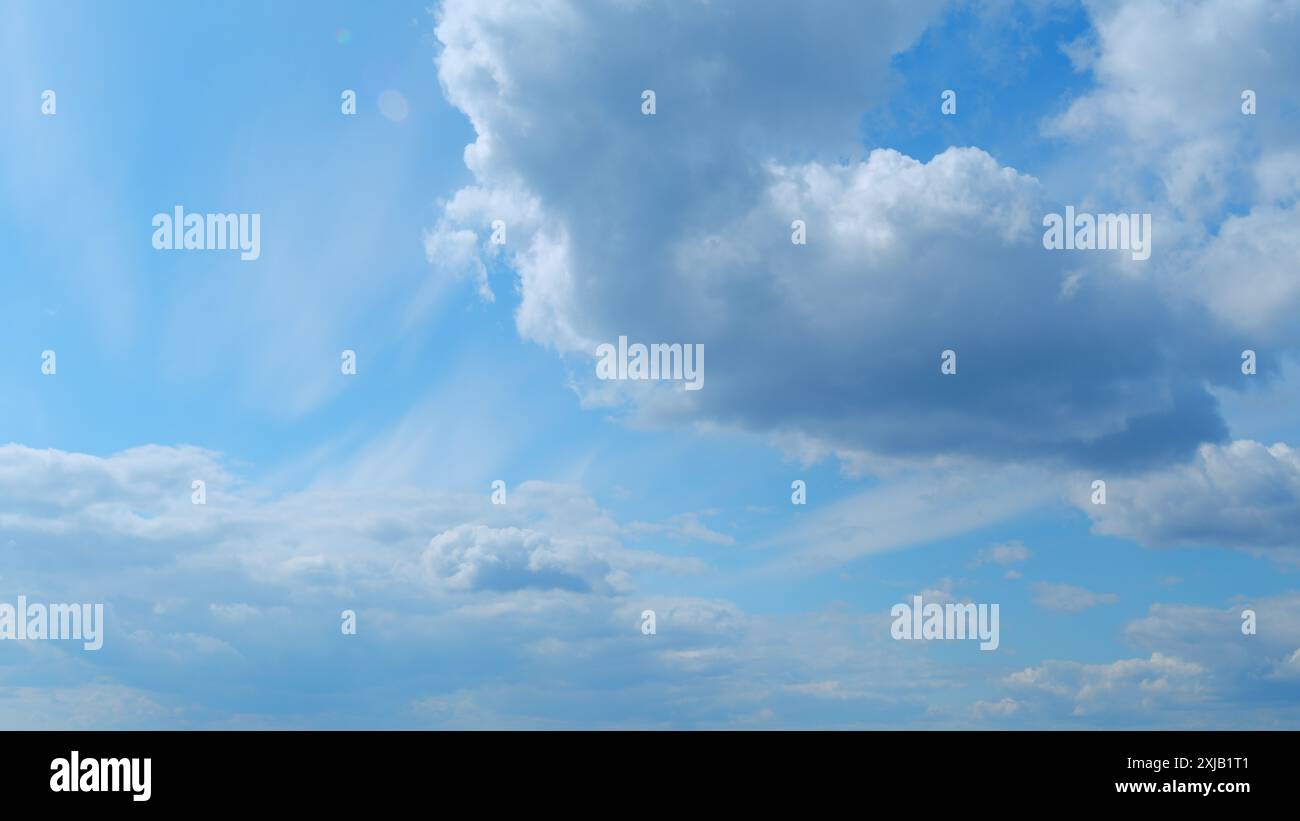 Time lapse. Sky with several layers of clouds moving in different ...