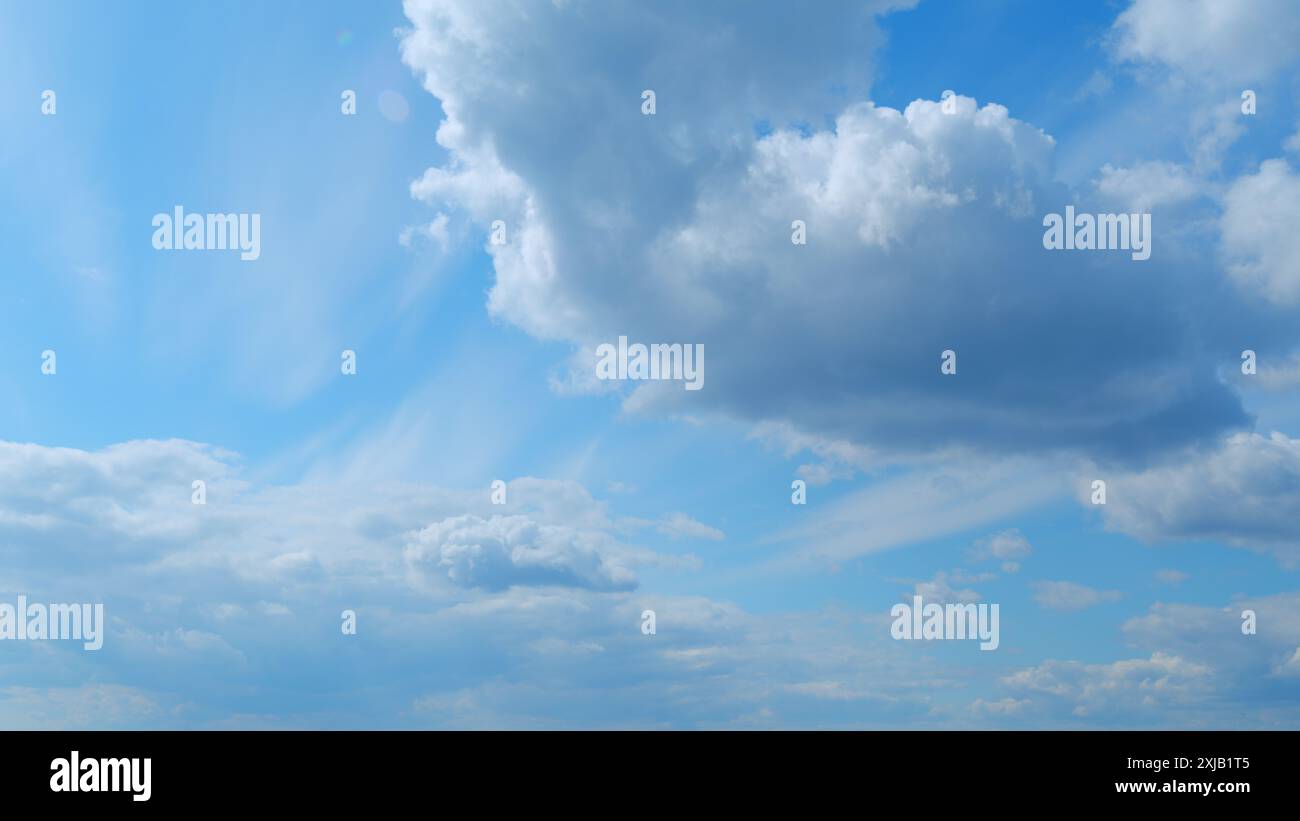 Time lapse. Fluffy layered clouds sky atmosphere. Majestic amazing blue ...