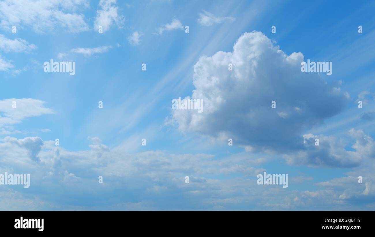 Time lapse. Blue heaven summer cloudscape. Rolling puffy white layered ...