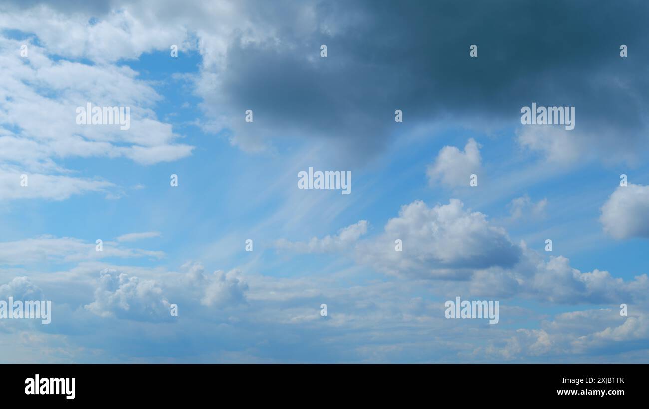 Time lapse. Fluffy layered clouds sky atmosphere. Puffy fluffy white ...