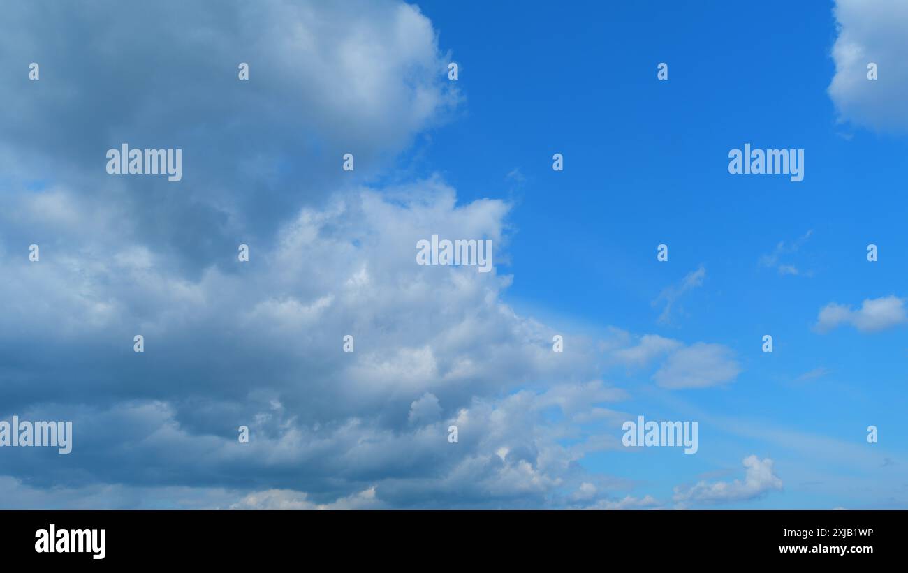 Time lapse. Dynamic cloud time-lapse from calm blue skies to cloudy ...