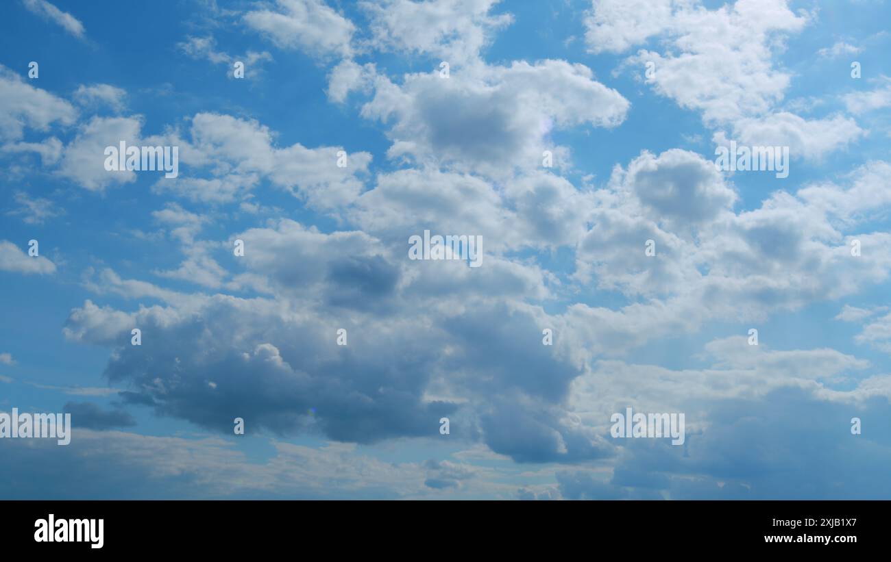 Time lapse. Beautiful blue sky with sunbeams and clouds. Clouds at blue ...