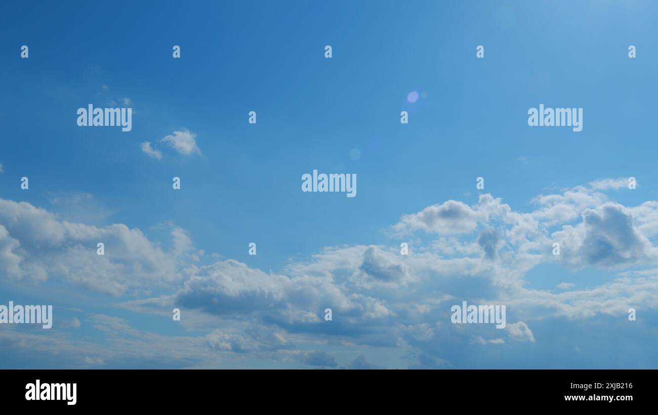 Time lapse. Fluffy curly rolling cloud in windy Summer weather. White ...