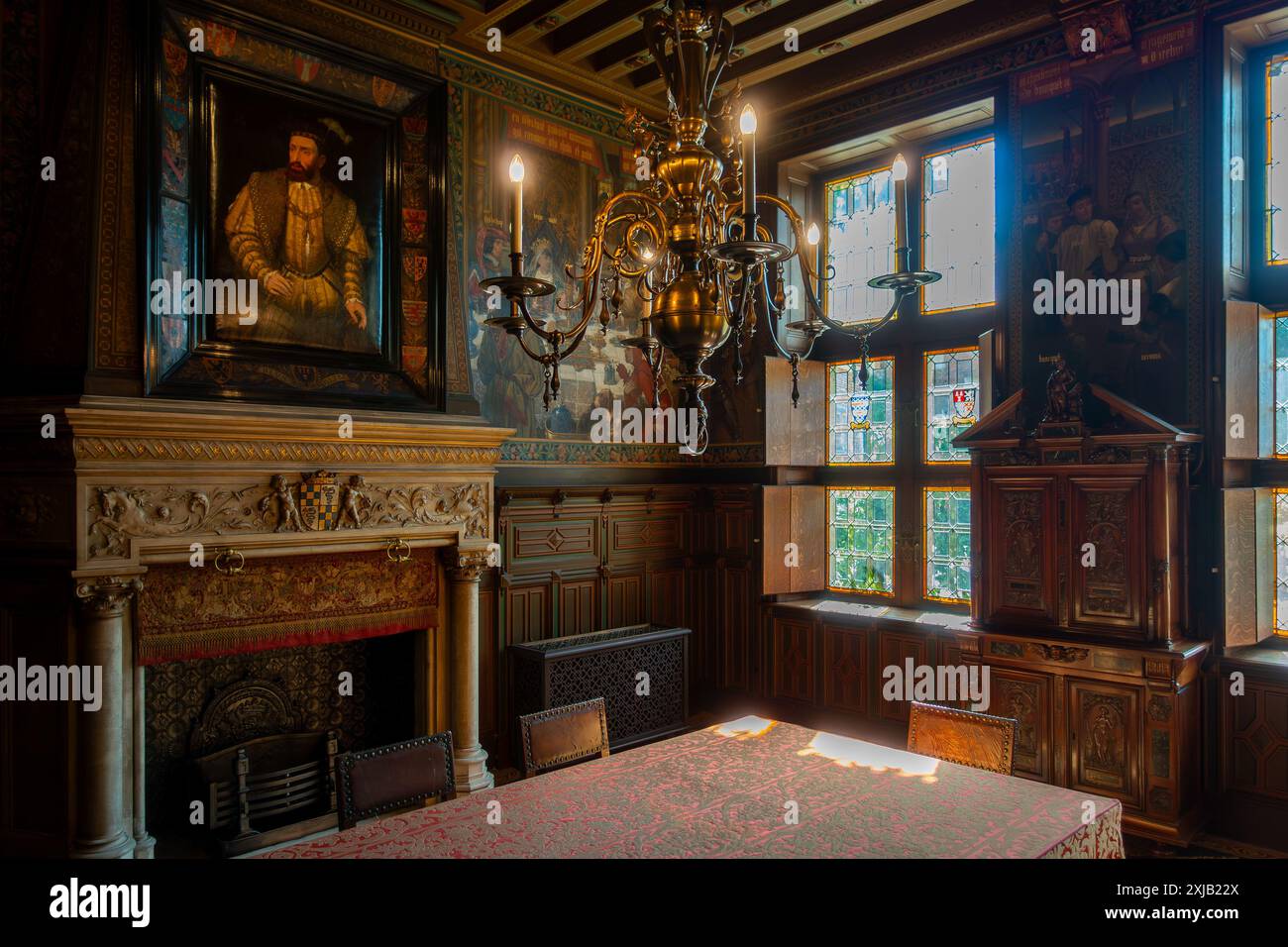 Chandelier in dining room of the Kasteel van Gaasbeek, medieval castle ...