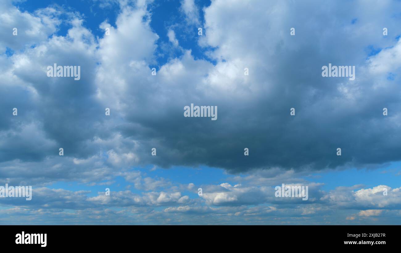 Time lapse. Rain clouds moving. Movement of air masses. White soft clouds quickly turning into ...