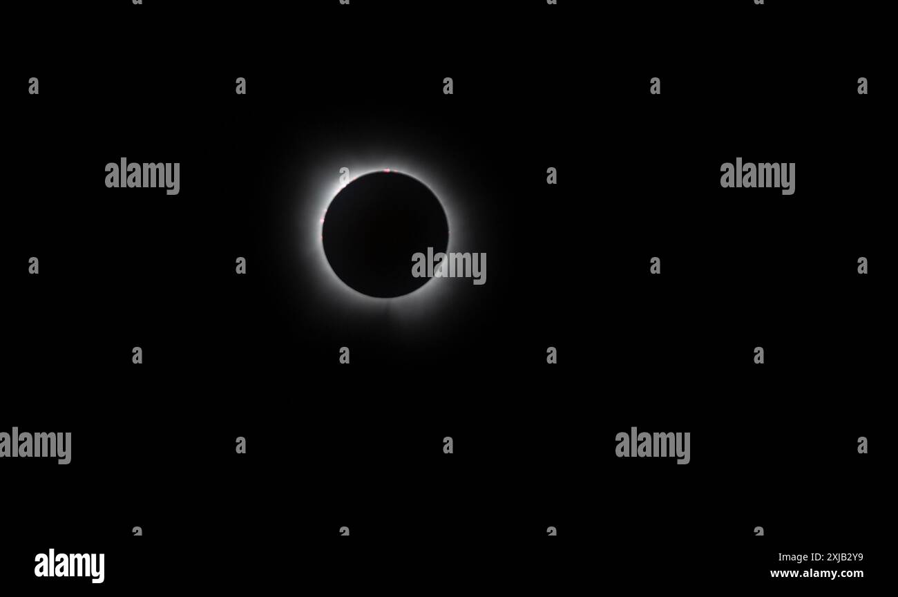A total eclipse of the sun occurring over Lake Buchanan in Burnet ...