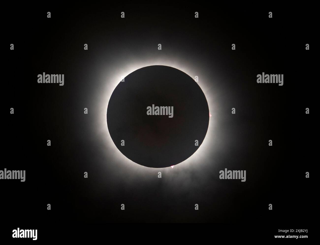 A total eclipse of the sun occurring over Lake Buchanan in Burnet ...