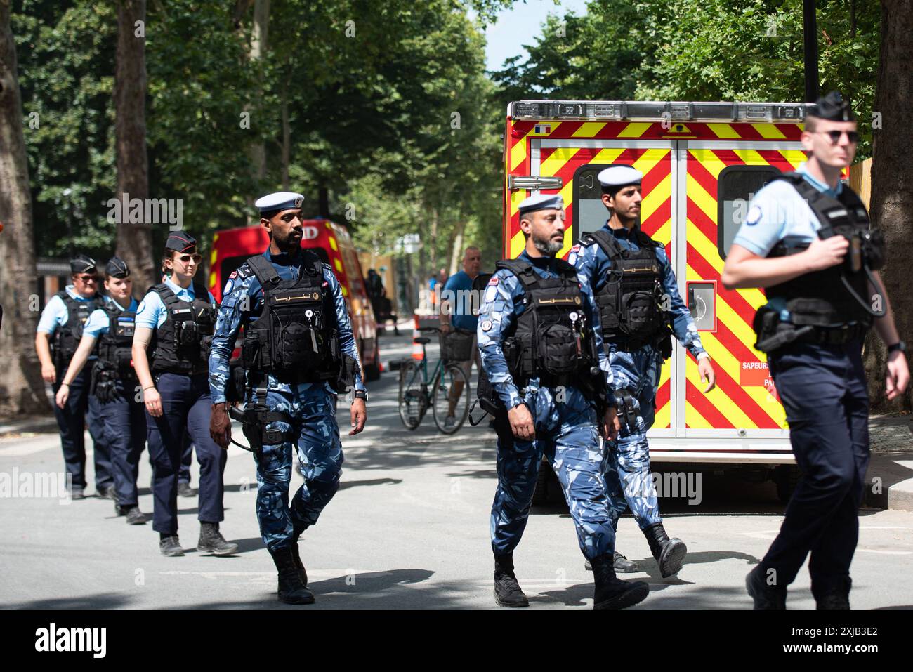 Paris, France. 17th July, 2024. Qatari police officers patrol alongside ...