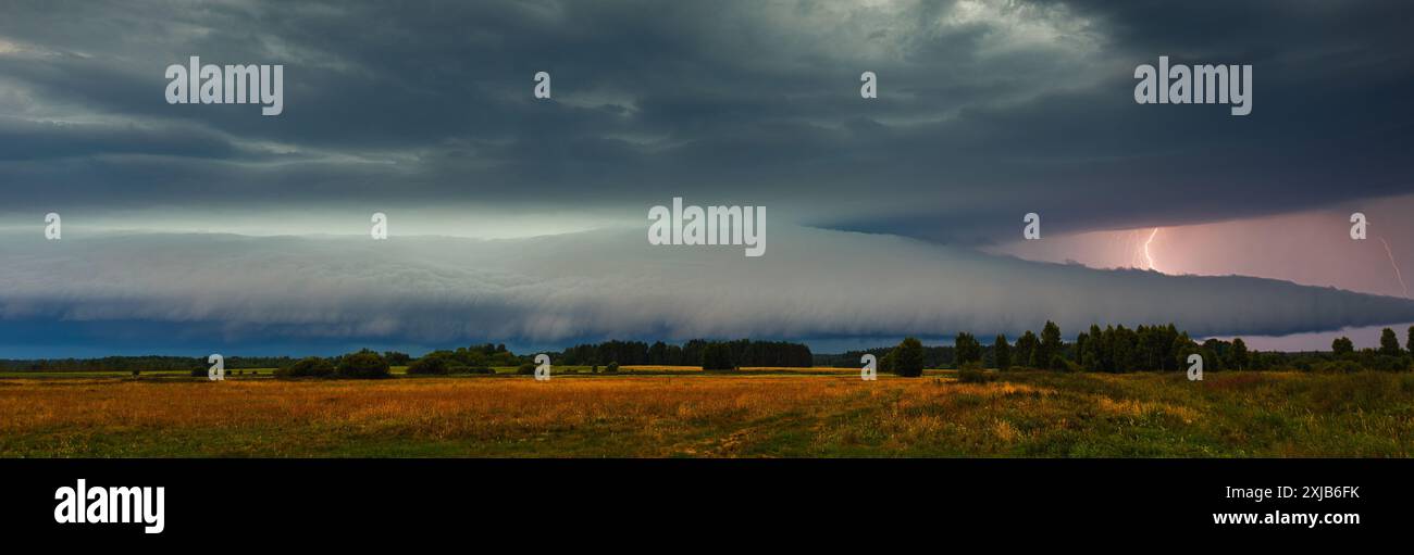 Supercell cloud with distant lightning illuminating the storm structure ...