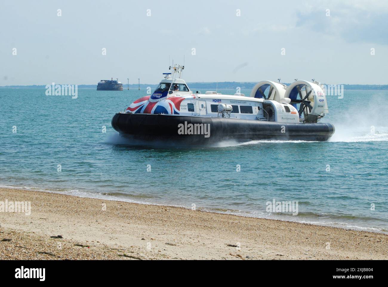 Hovercraft, arriving in Southsea Harbour beach, sea, and sky, and spray Stock Photo - Alamy