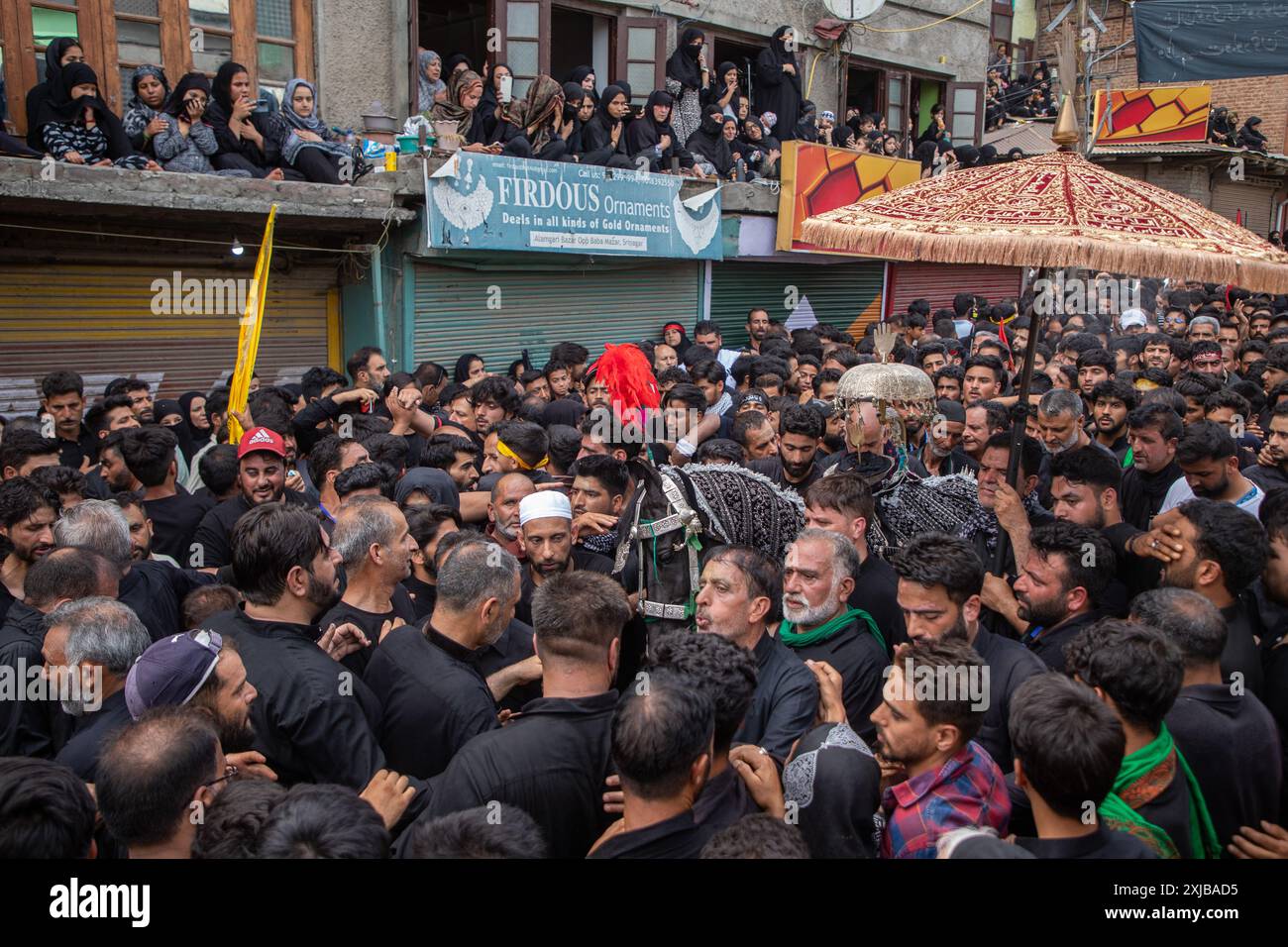 Srinagar, India. 17th July, 2024. Shiite Muslims walk with a Horse ...
