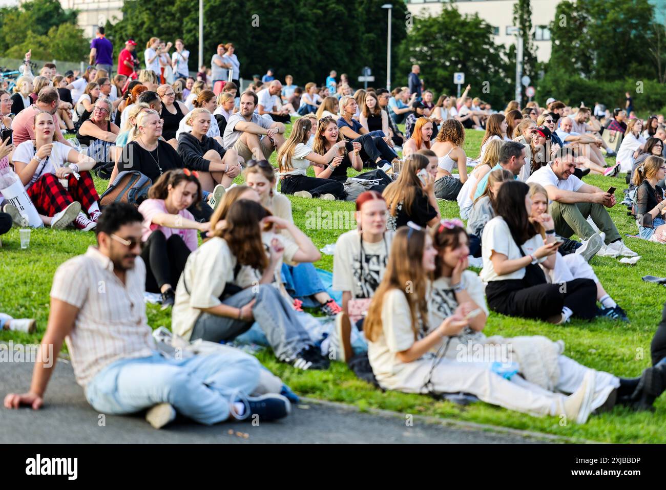 Gelsenkirchen, Germany. 17th July, 2024. Hundreds of fans sit on a ...