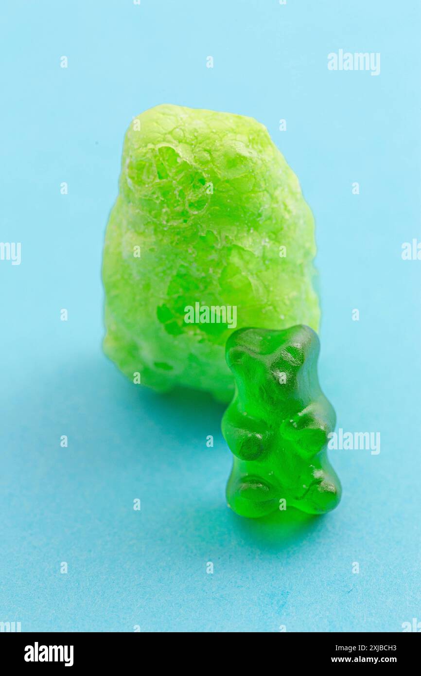 A Freeze Dried Gummy Bear Shaped Candy Isolated on a Blue Background ...
