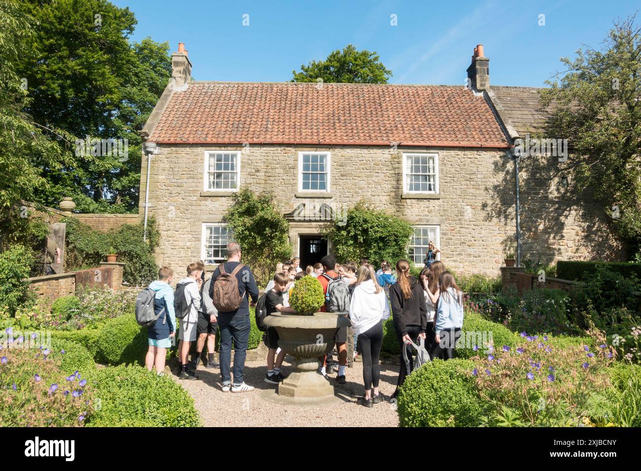 A group of school children outside Pockerley Manor house at Beamish ...
