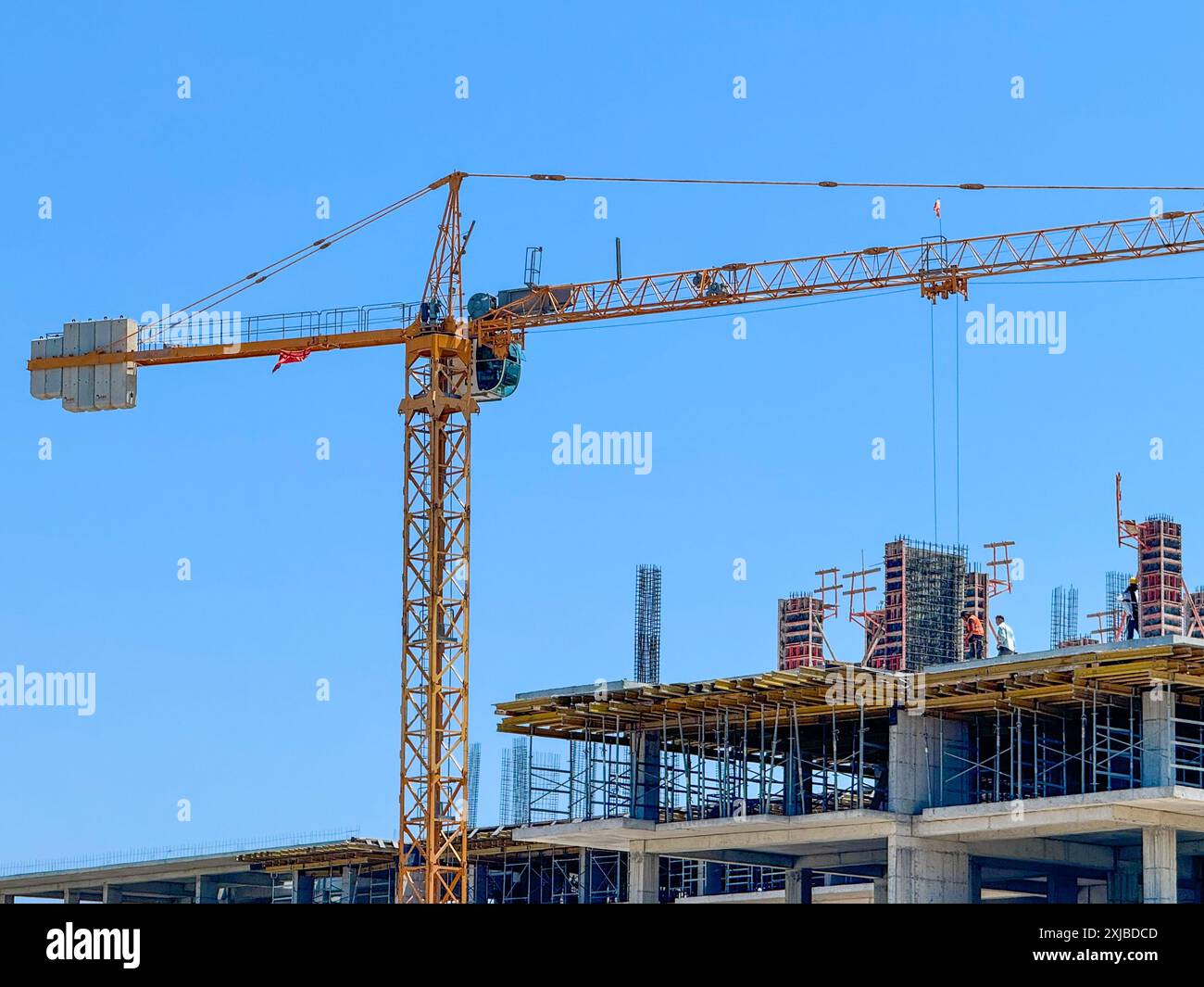 Hoisting crane and building activity Stock Photo - Alamy