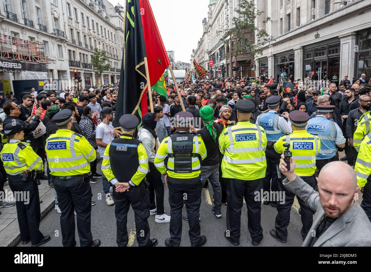 London, UK. 17 July 2024. Police monitor the march on Regent Street as ...