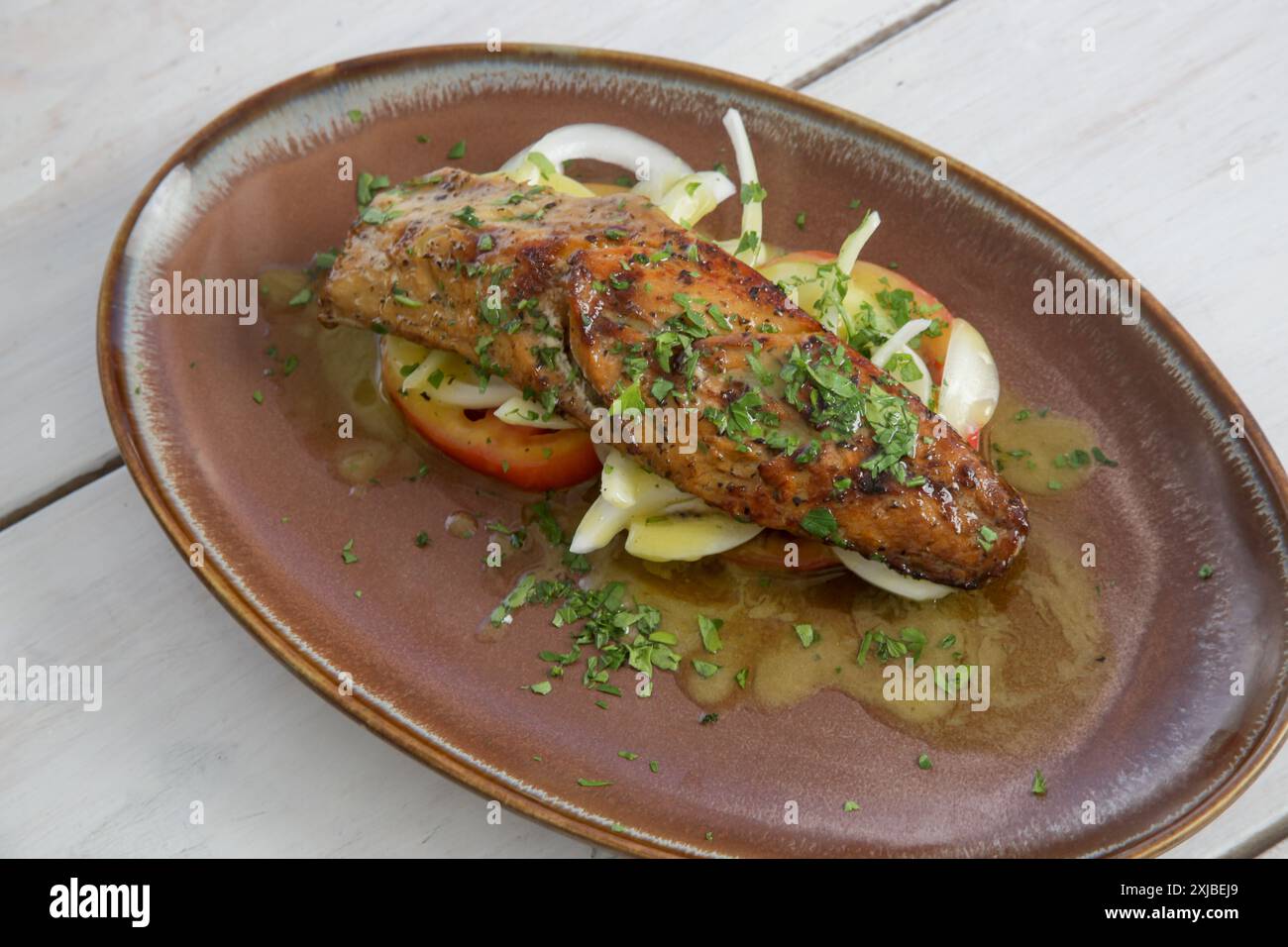 Grilled mackerel fish on fresh vegetables with olive oil Stock Photo ...