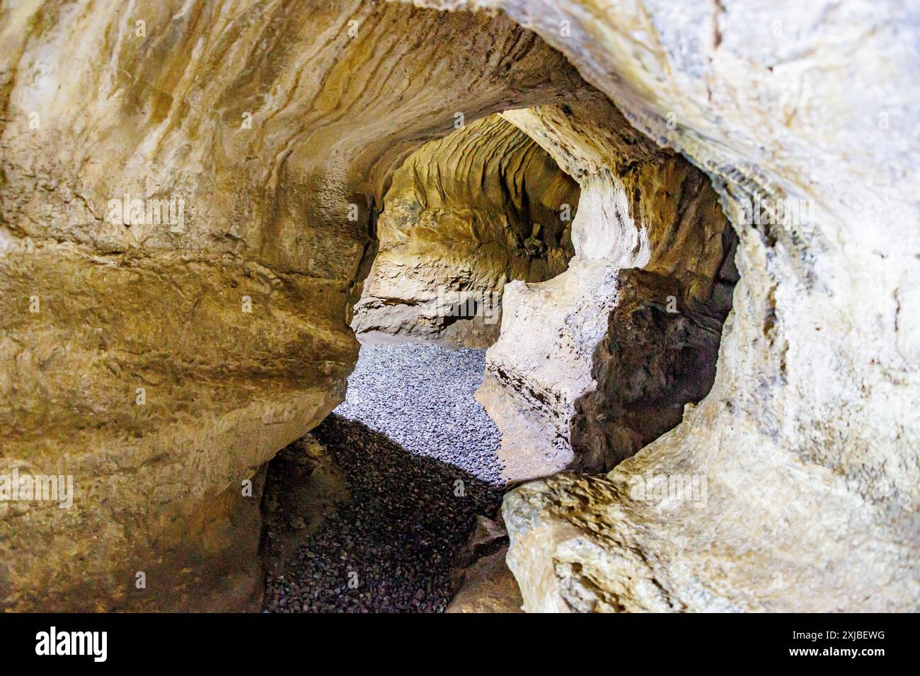 Underground tunnels inside cave in a rock formation at Logne Castle ...