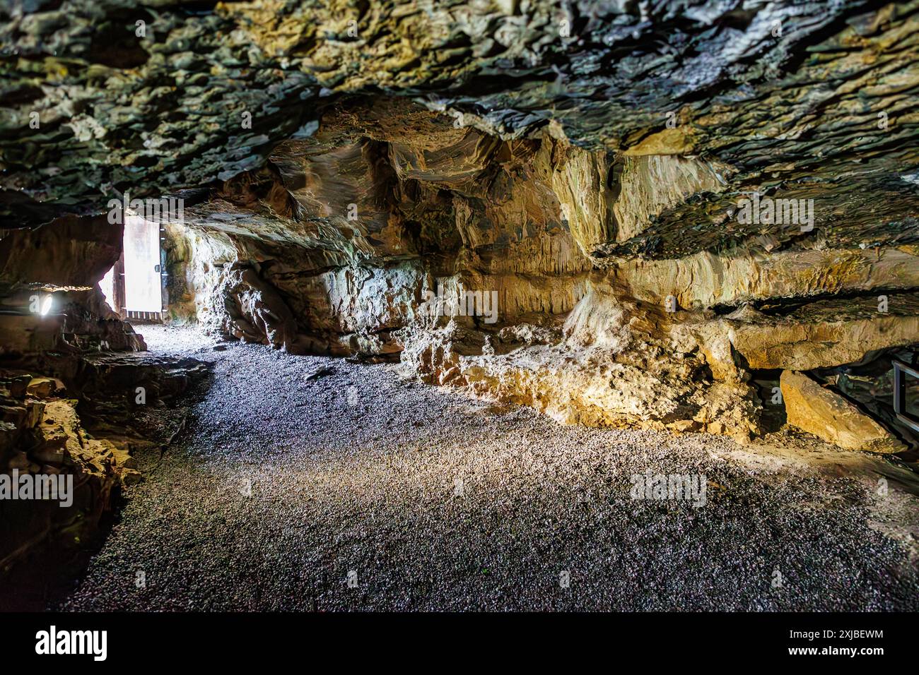 Underground cave inside rock formation at Logne Castle, illuminated ...