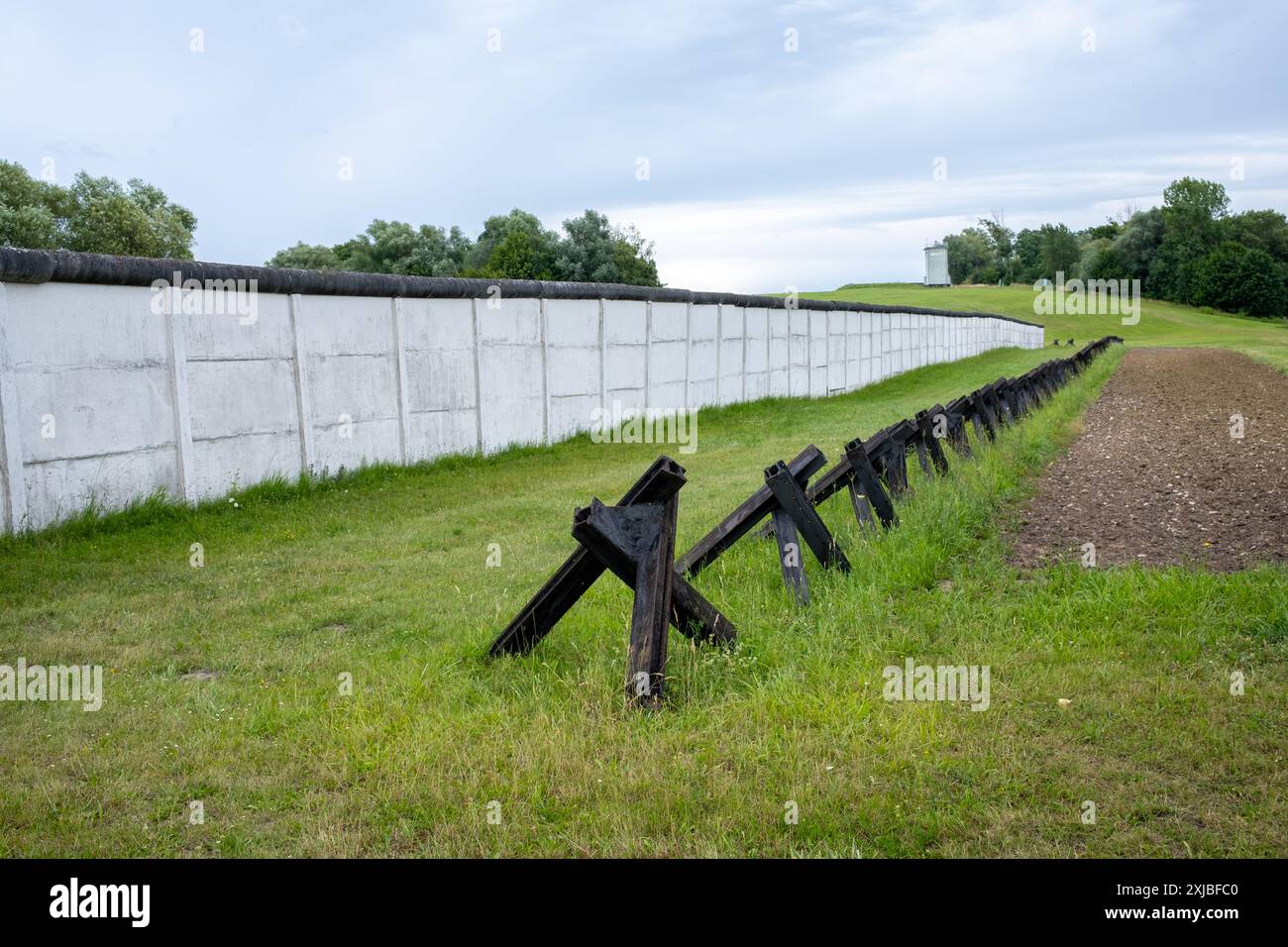 remains of the wall and anti-tank barriers still stand along the former ...