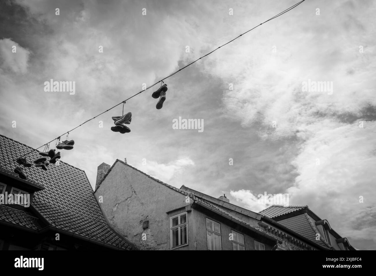 many pairs of shoes hang on an electric cable Stock Photo - Alamy many pairs of shoes hang on an electric cable Stock Photo - Alamy