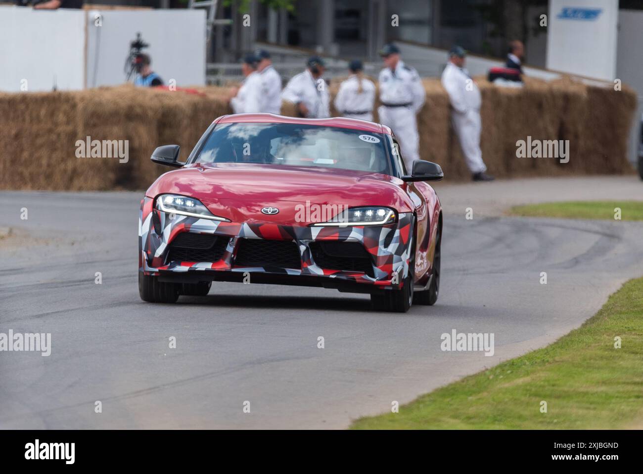 Toyota Supra sports car driving up the hill climb track at the Goodwood ...