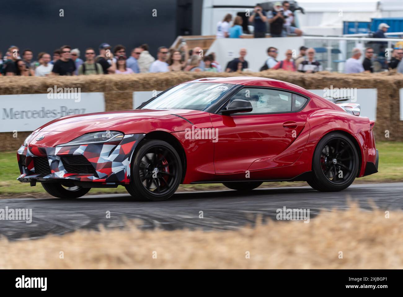 Toyota Supra sports car driving up the hill climb track at the Goodwood ...