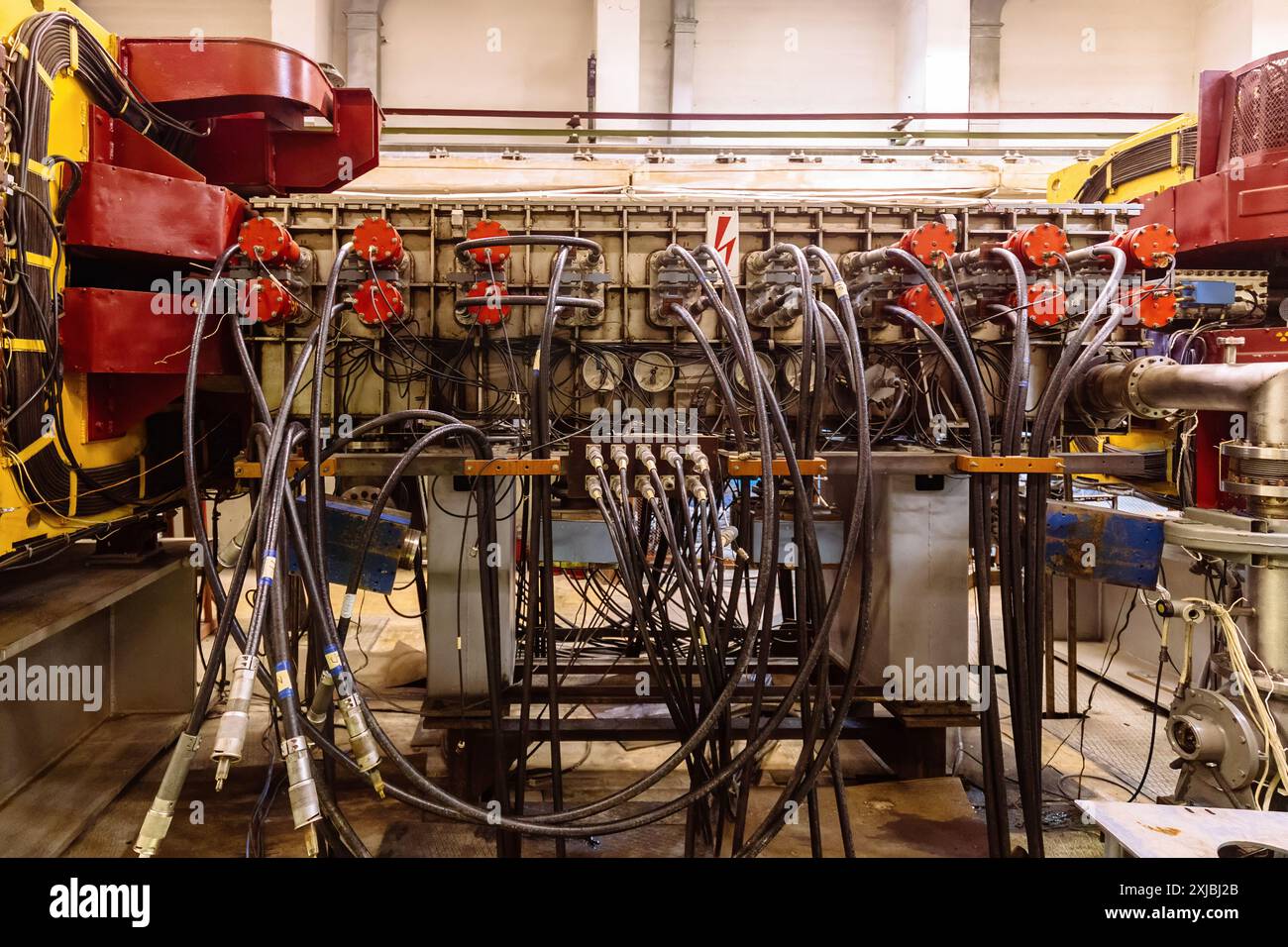 Industrial machine part. Connected high voltage cables, voltmeters and ...