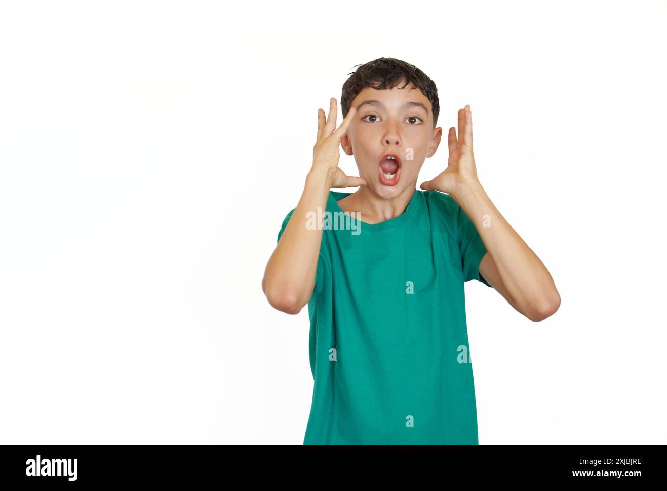 preadolescent boy on a white background with a gesture of great ...