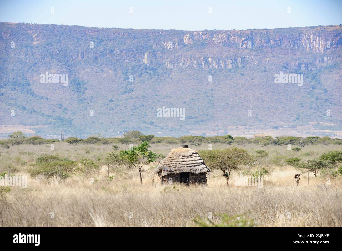 African square hut in wood and stones with thatched roof in the ...